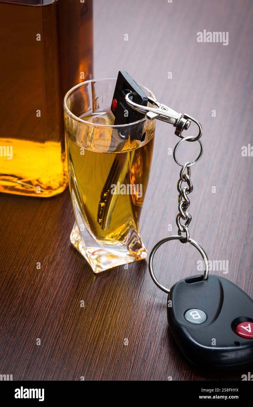 Car key on the bar with spilled alcohol Stock Photo - Alamy