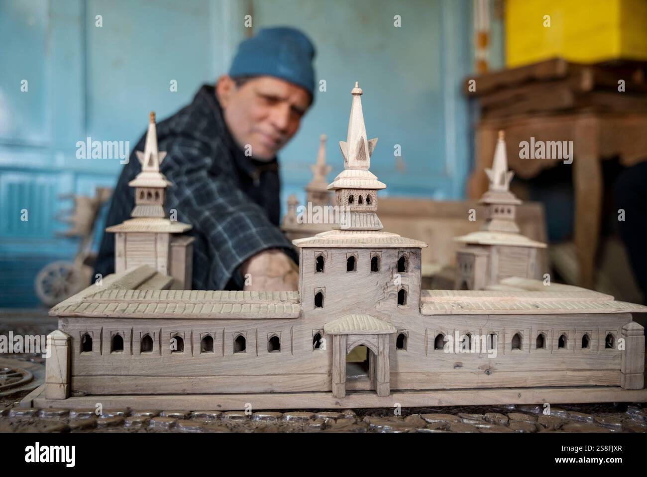 Mohammed Yousaf Muran showcases his handcrafted walnut wood replica of ...