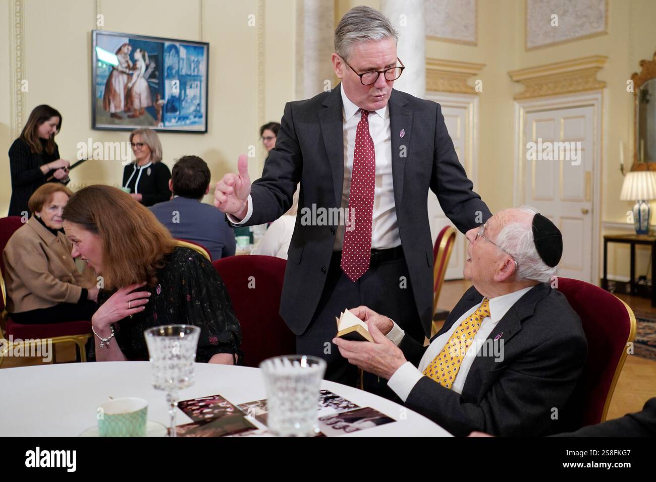 Prime Minister Sir Keir Starmer speaking to Harry Olmer during a ...