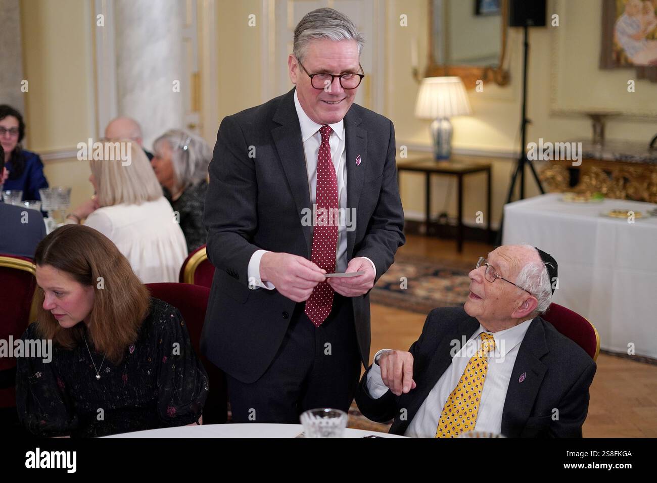 Prime Minister Sir Keir Starmer speaking to Harry Olmer during a ...
