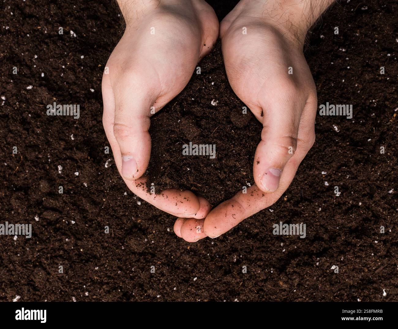 Handful of Rich Brown Soil Stock Photo - Alamy
