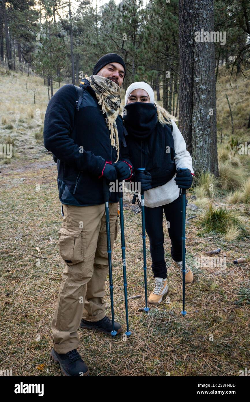 Two mountaineers is seen enthusiastically climbing a volcano. This ...