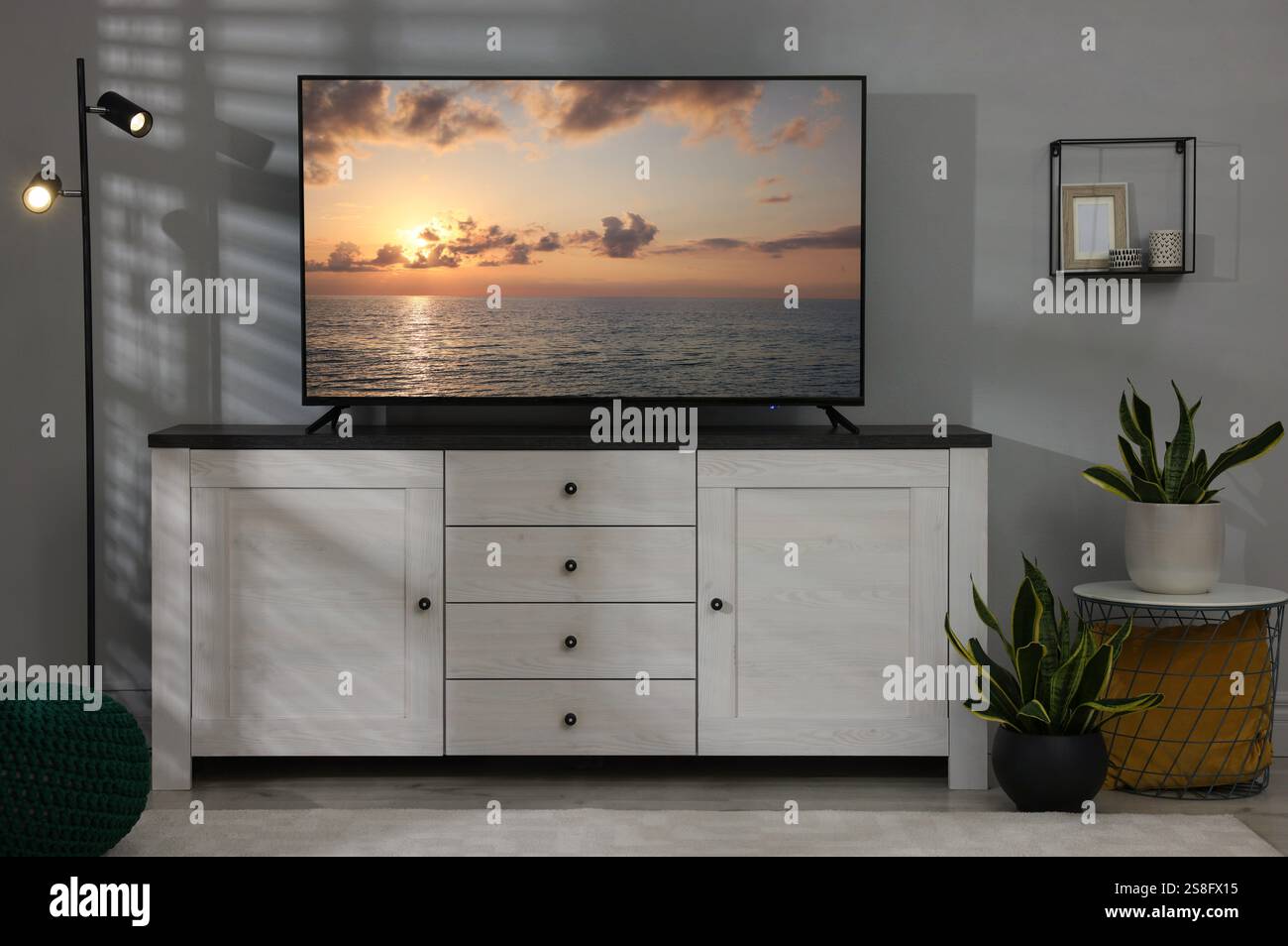 TV set with nature landscape on screen in room Stock Photo - Alamy