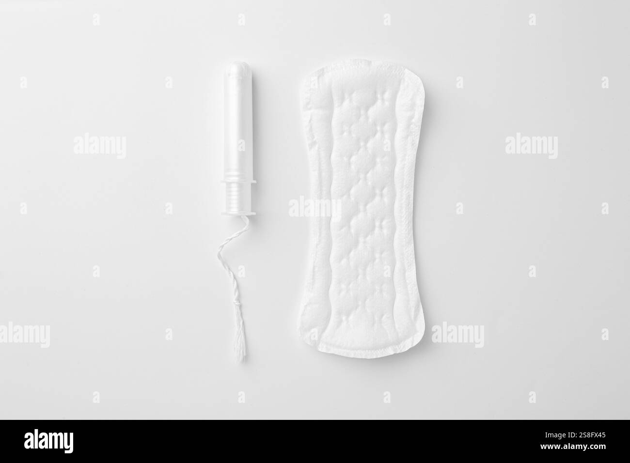 Menstrual pad and tampon on white background, top view Stock Photo - Alamy