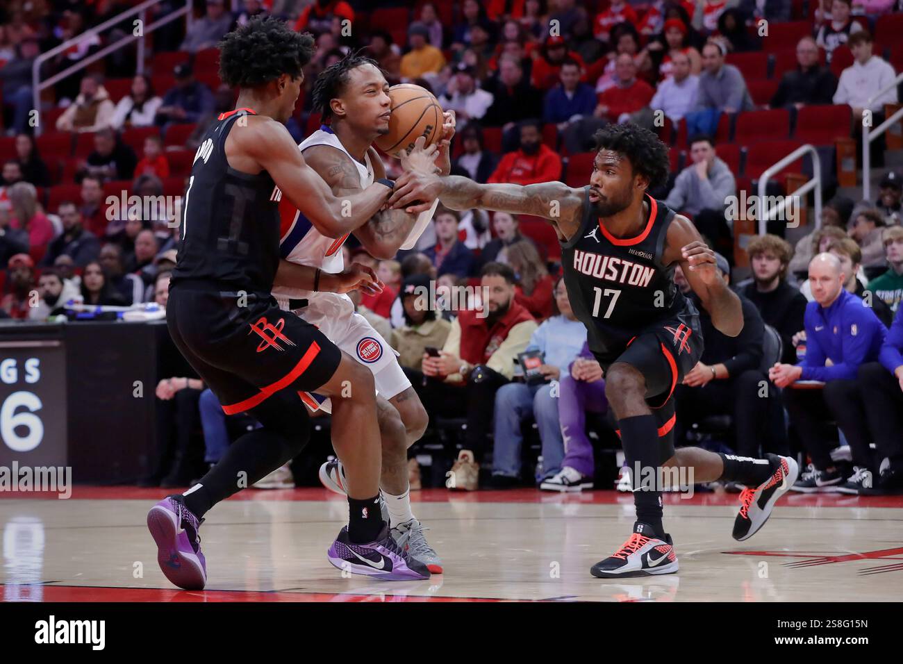 Detroit Pistons forward Ronald Holland II, center, is fouled as he ...