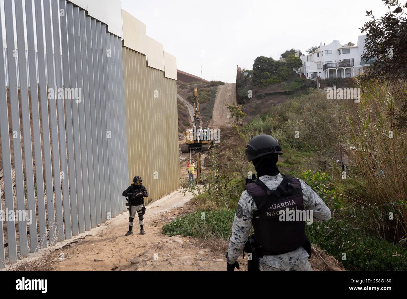 Members of the Mexican National Guard patrol as construction crews ...