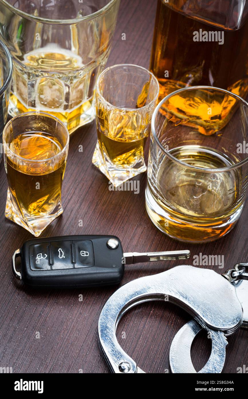 Car key on the bar with spilled alcohol Stock Photo - Alamy