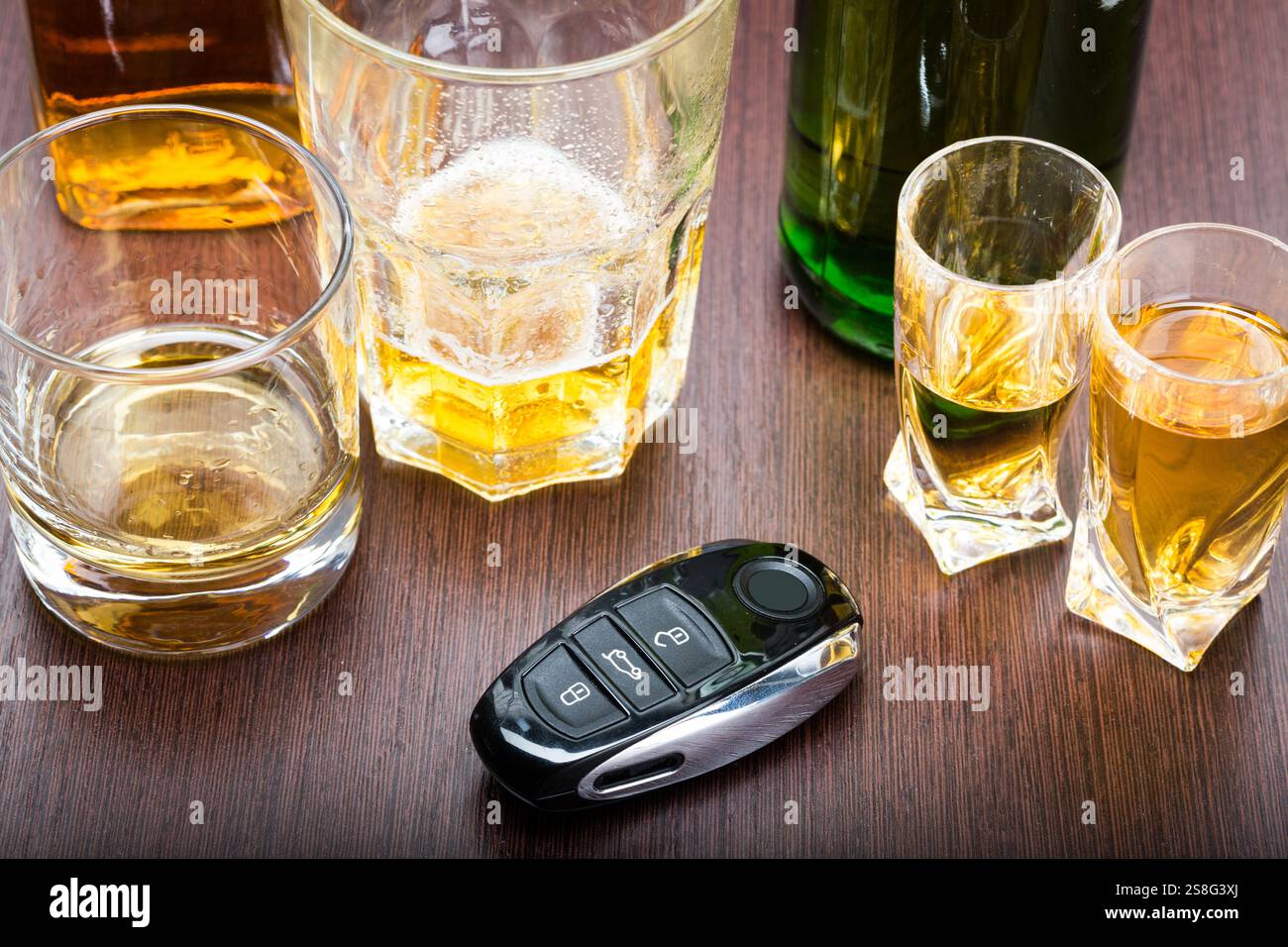 Car key on the bar with spilled alcohol Stock Photo - Alamy