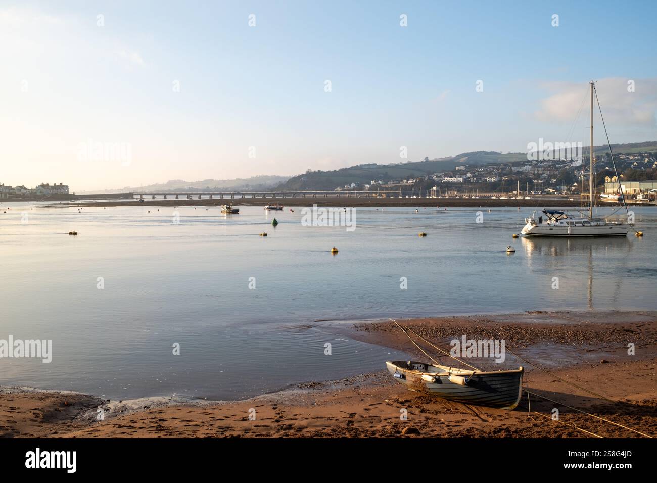 Docks and river beach view on the River Teign looking up the river ...