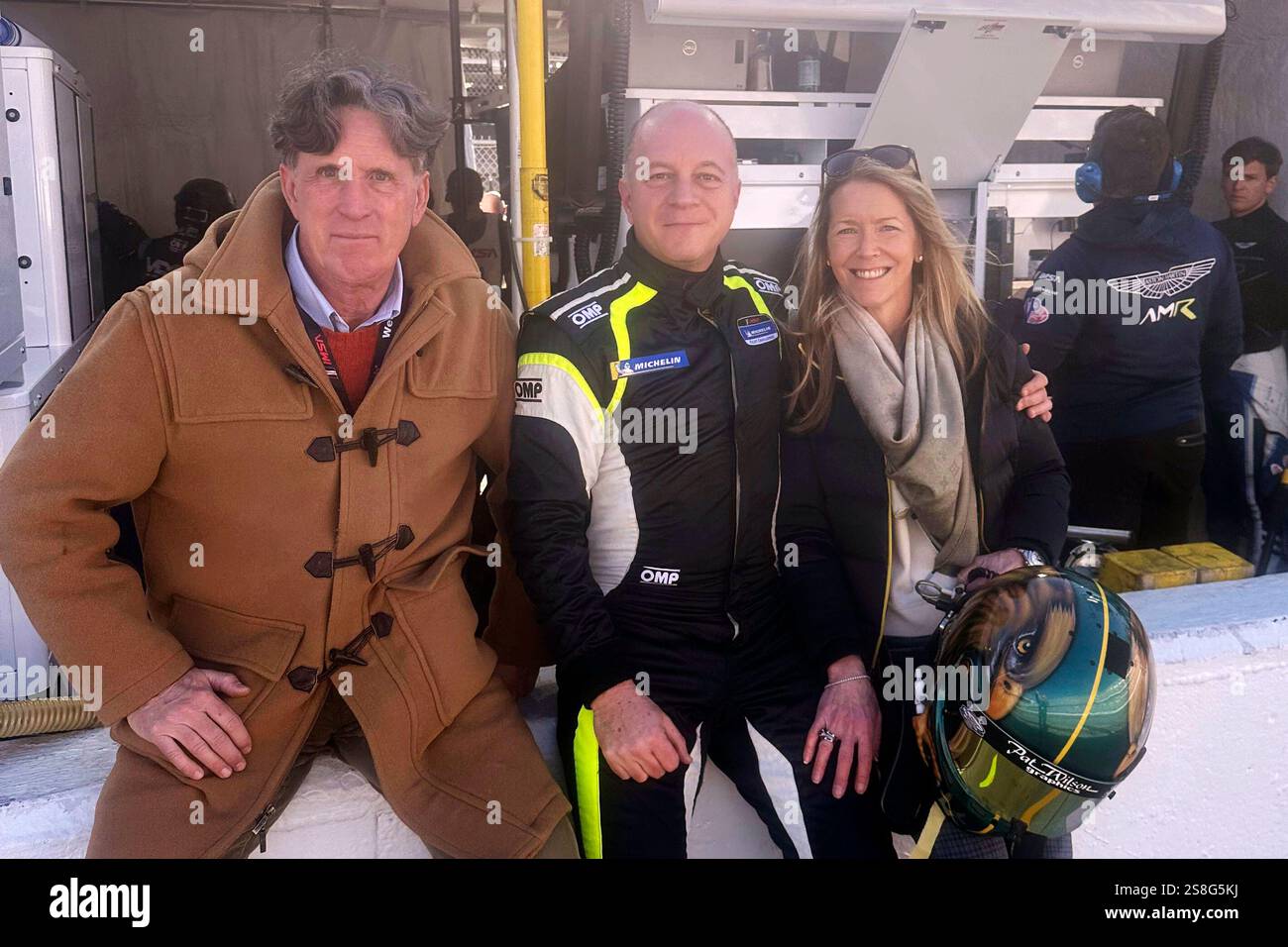 Driver coach and part-time racer Mike Peters sits with husband and wife ...