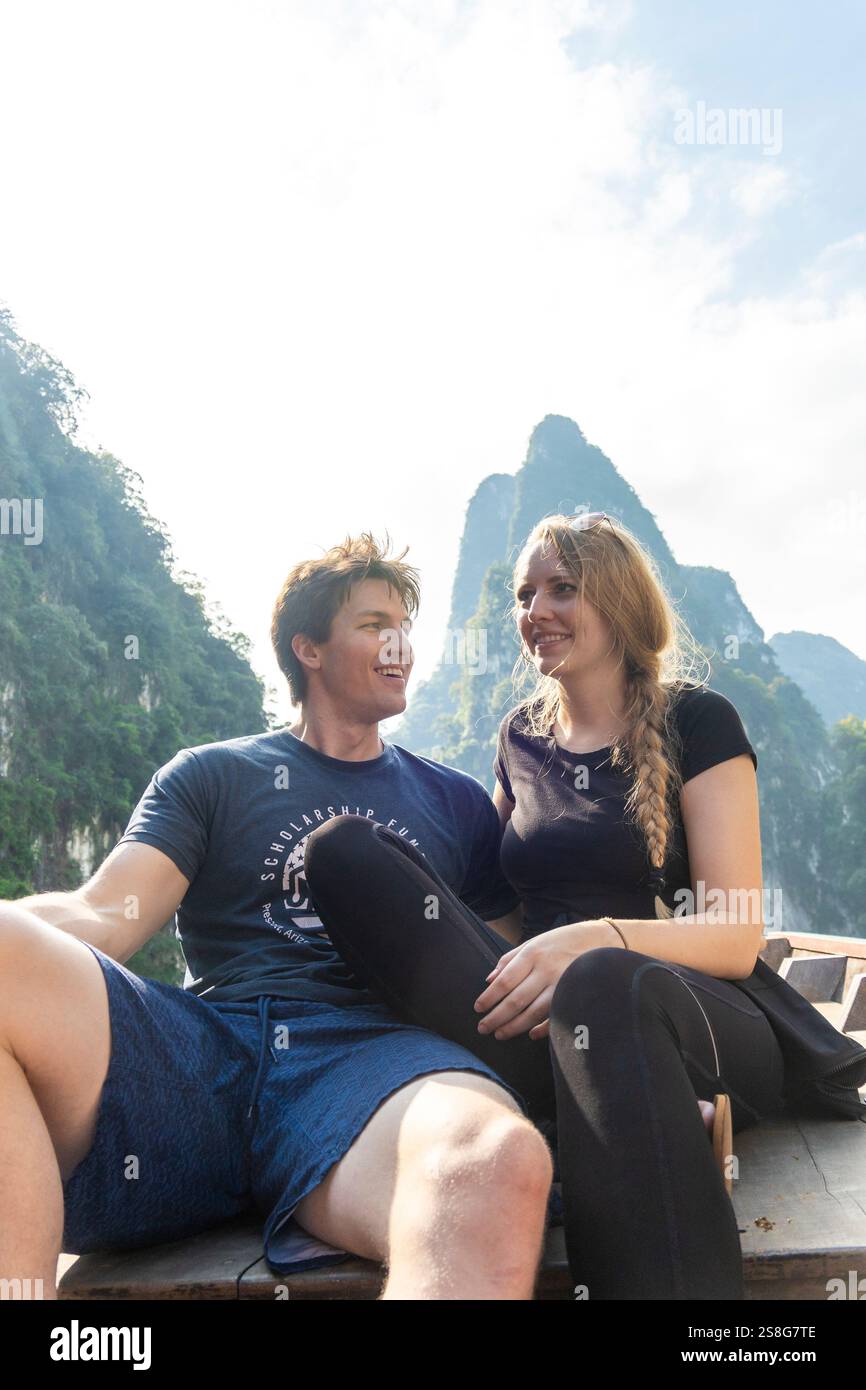 Scenic boat ride under towering limestone cliffs in Thailand's stunning ...