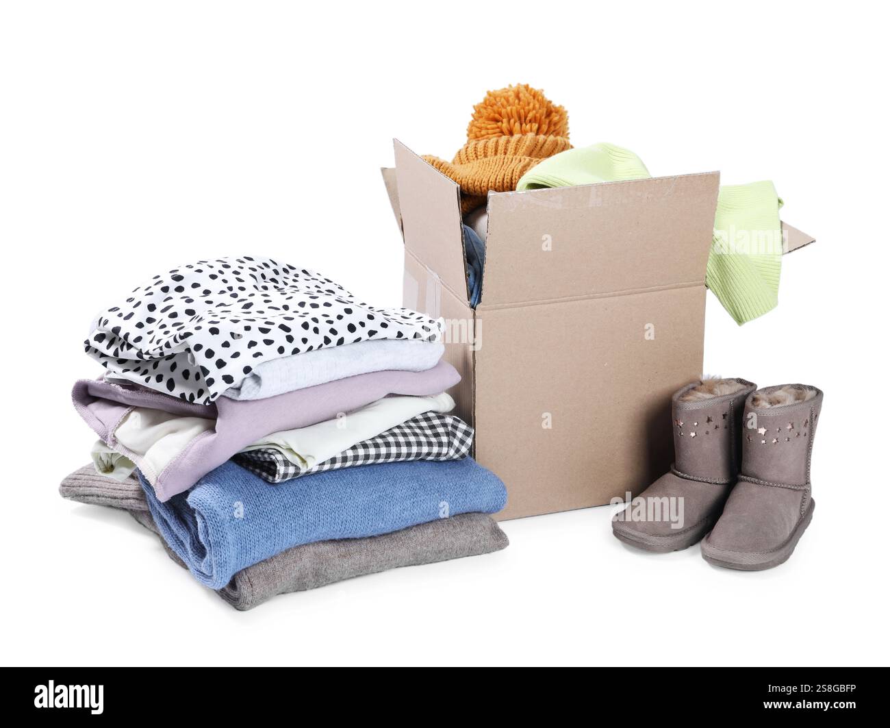 Box with different used clothes and boots isolated on white Stock Photo ...