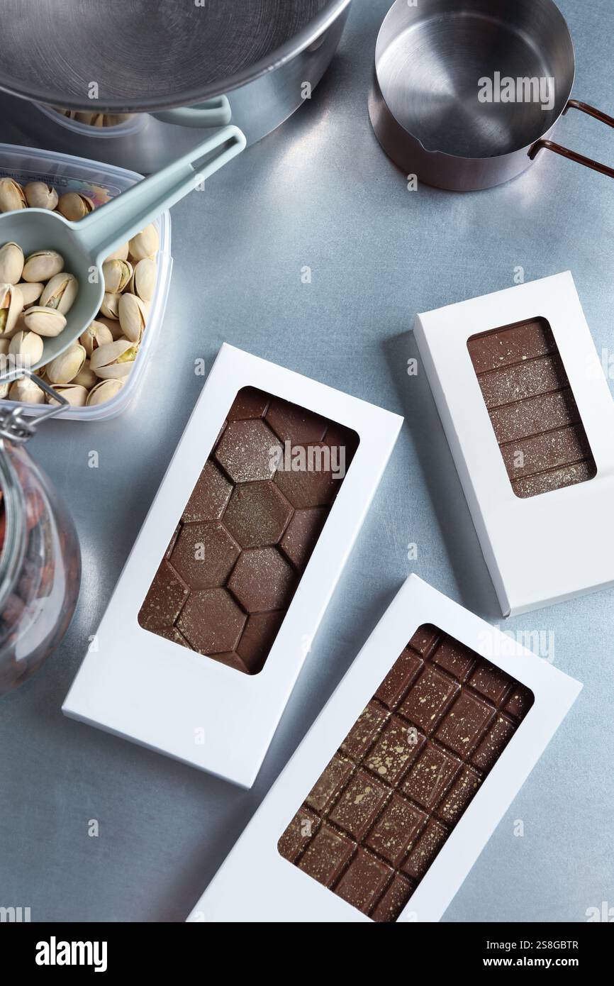 Different tasty Dubai chocolate bars in packages with pistachios and ...