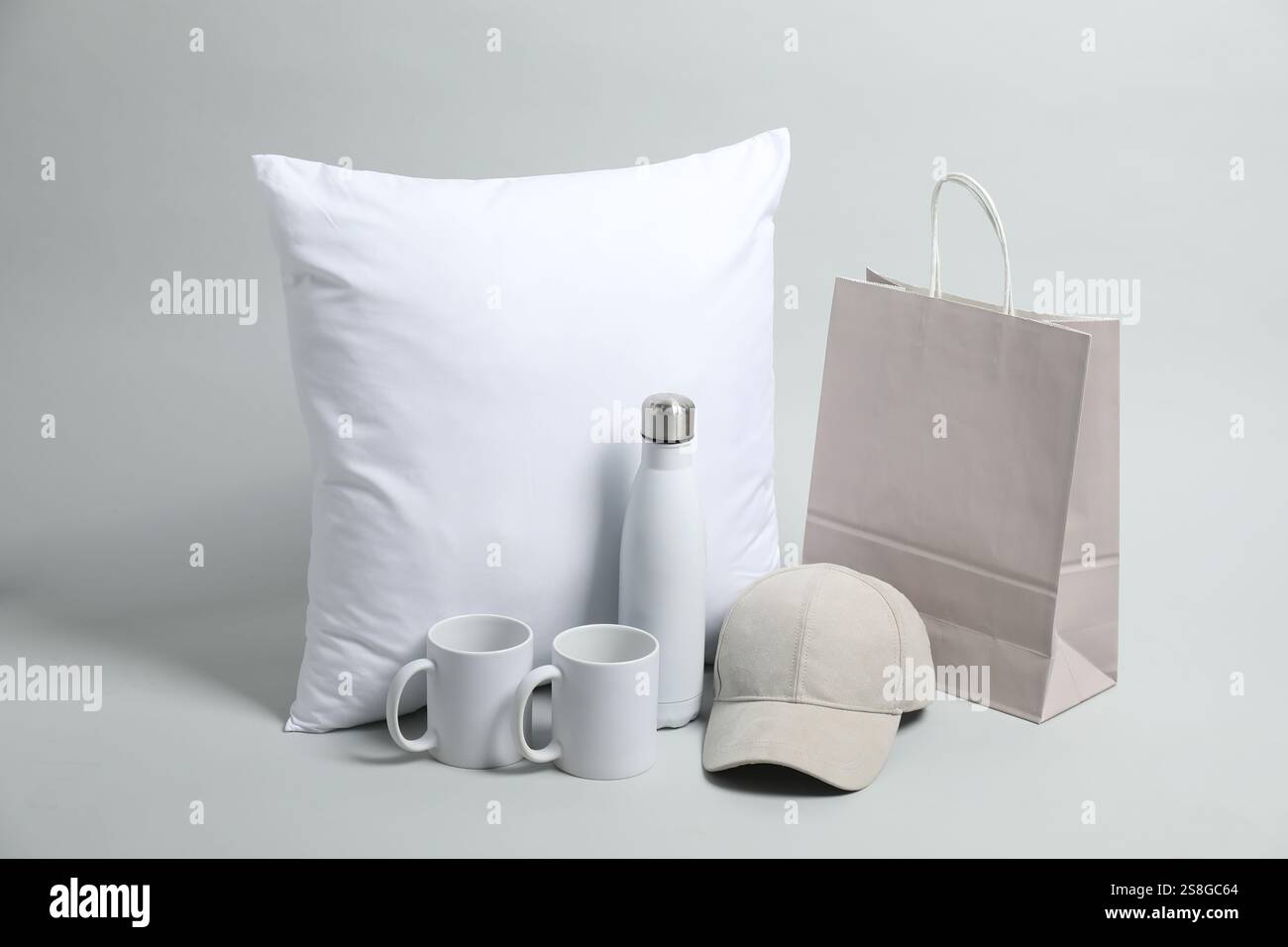 Different blank items for branding on light grey background. Mockup for ...