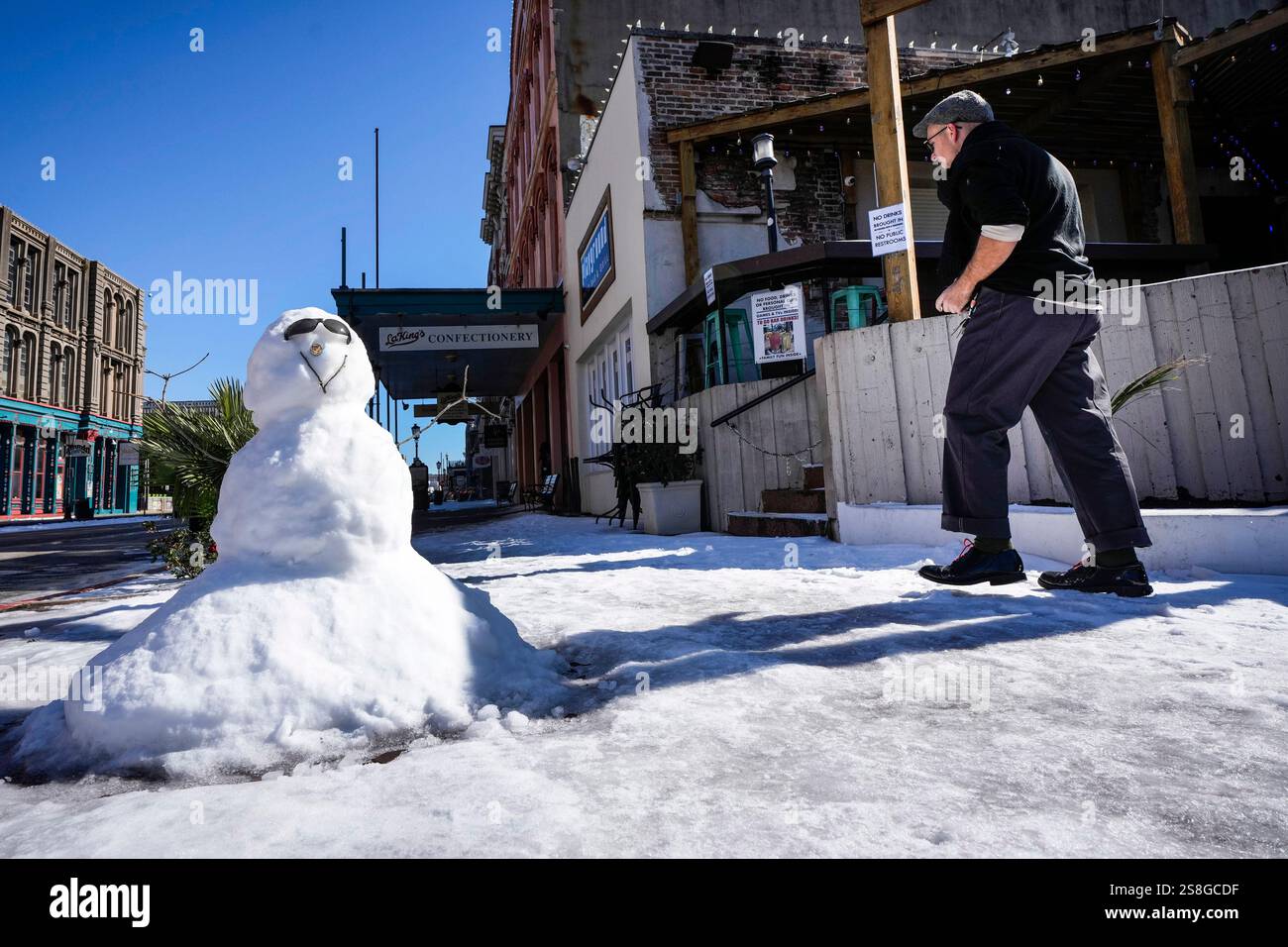 A snowman still stands as snow and ice begin to melt in The Strand as ...