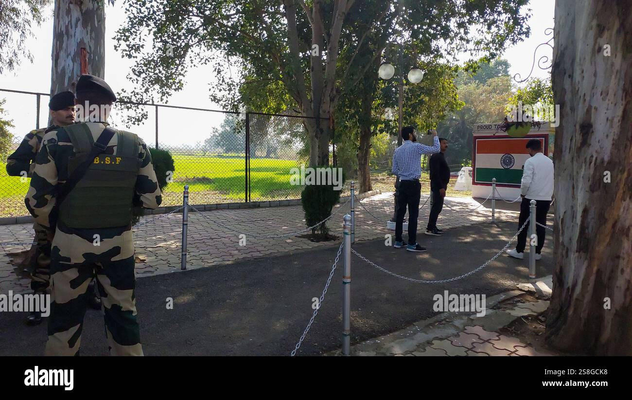 Indian Border Security Force (BSF) soldiers stand guard as visitors ...