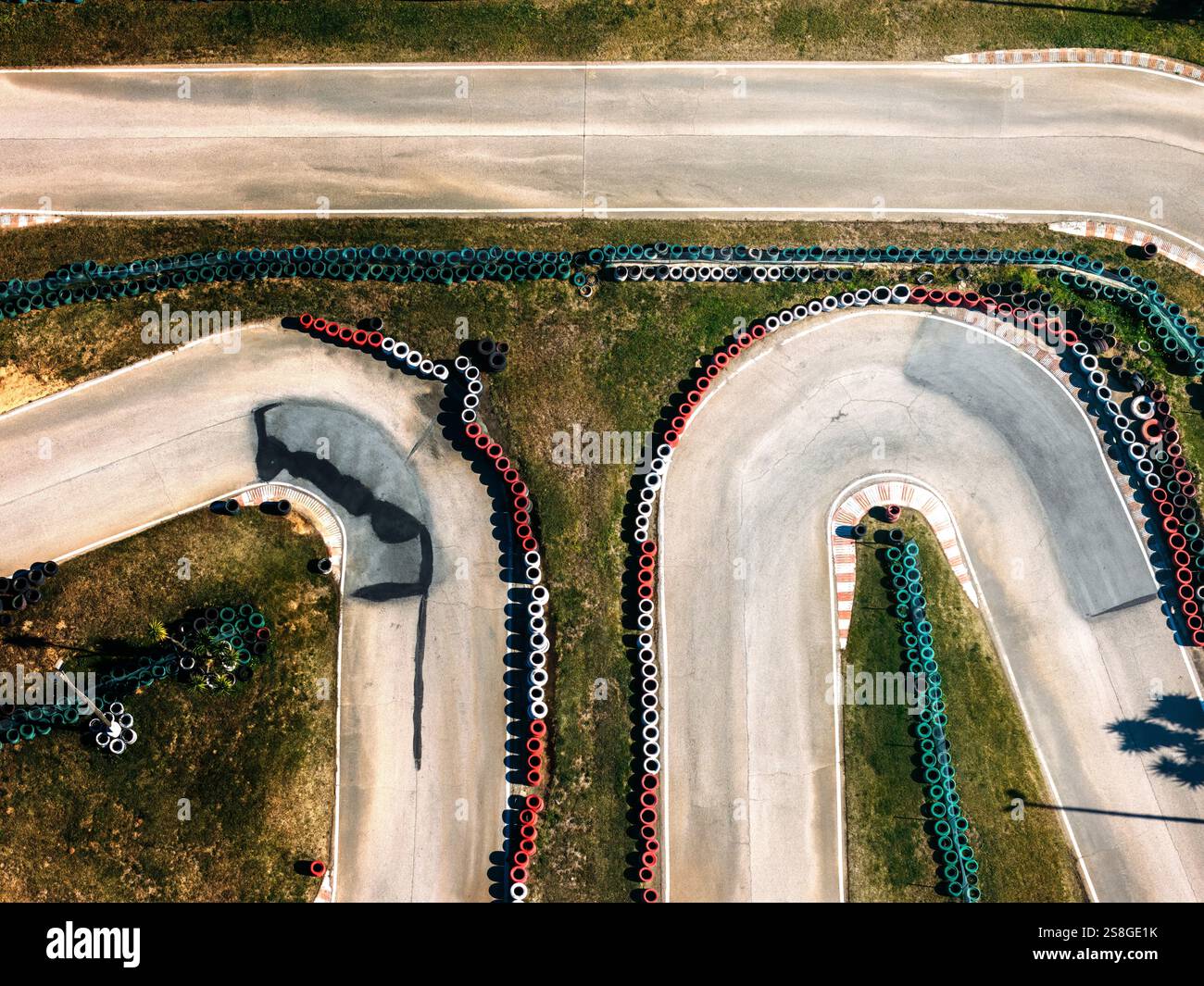 An aerial view captures a motorcar racing track featuring several sharp ...