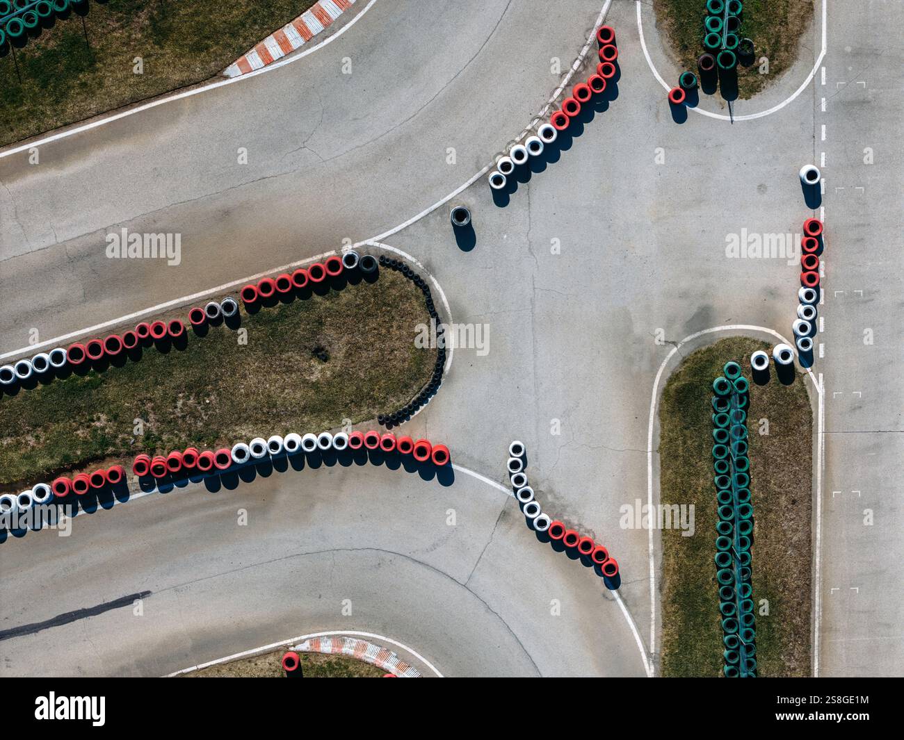 An aerial view captures a motorcar racing track featuring several sharp ...