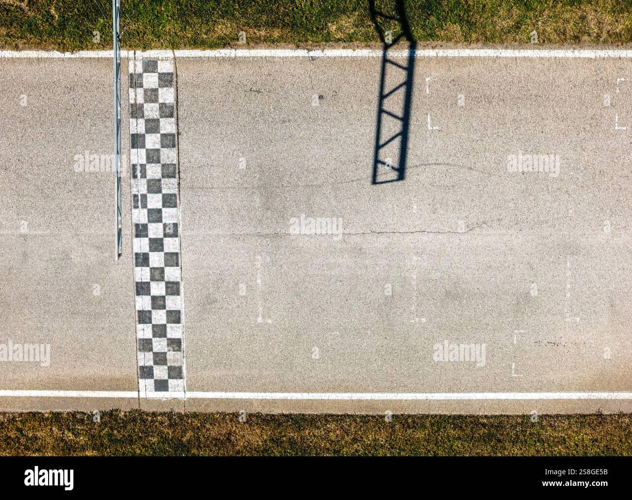 The ground is marked with a black and white checkered pattern ...