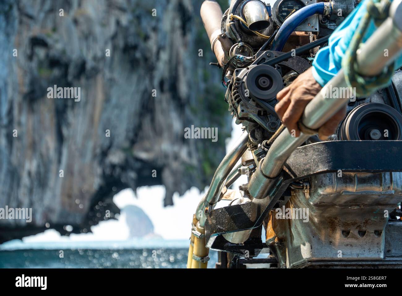 Scenic boat ride under towering limestone cliffs in Thailand's stunning ...