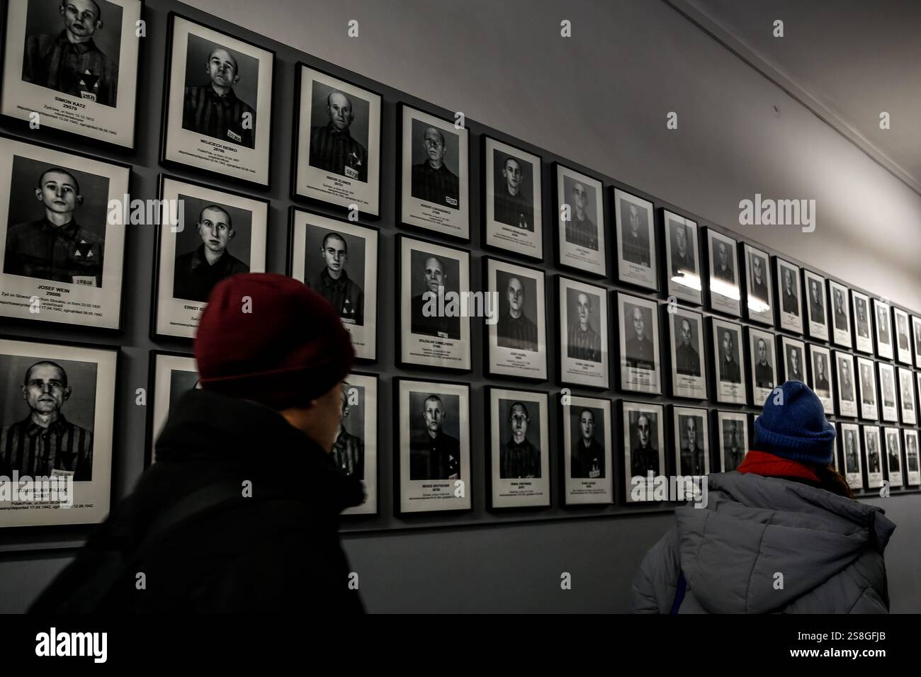 Oswiecim, Poland, on January 22, 2025. Visitors watch the exhibition ...