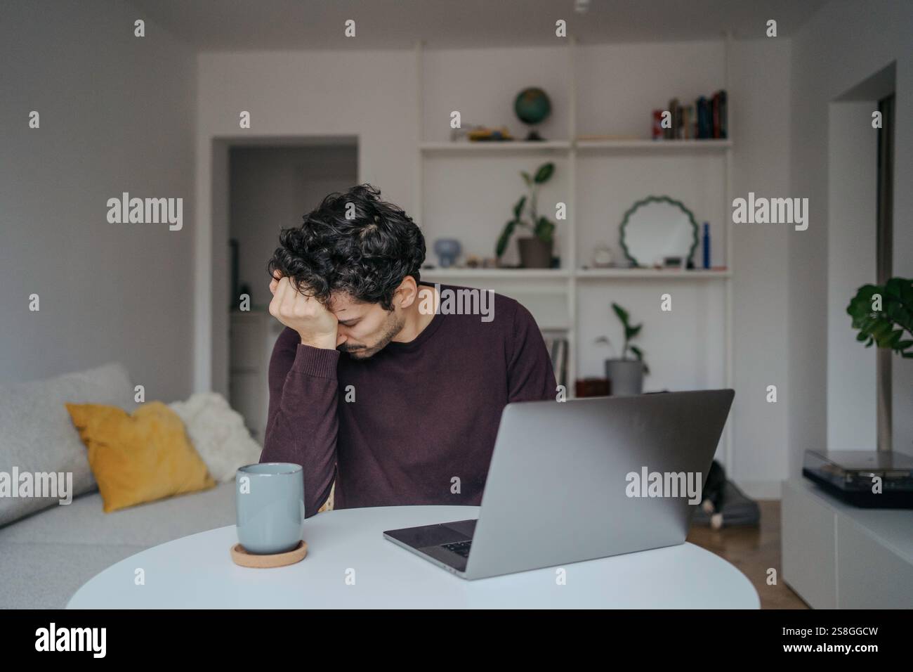 Young stressed looking handsome middle eastern man using computer and ...