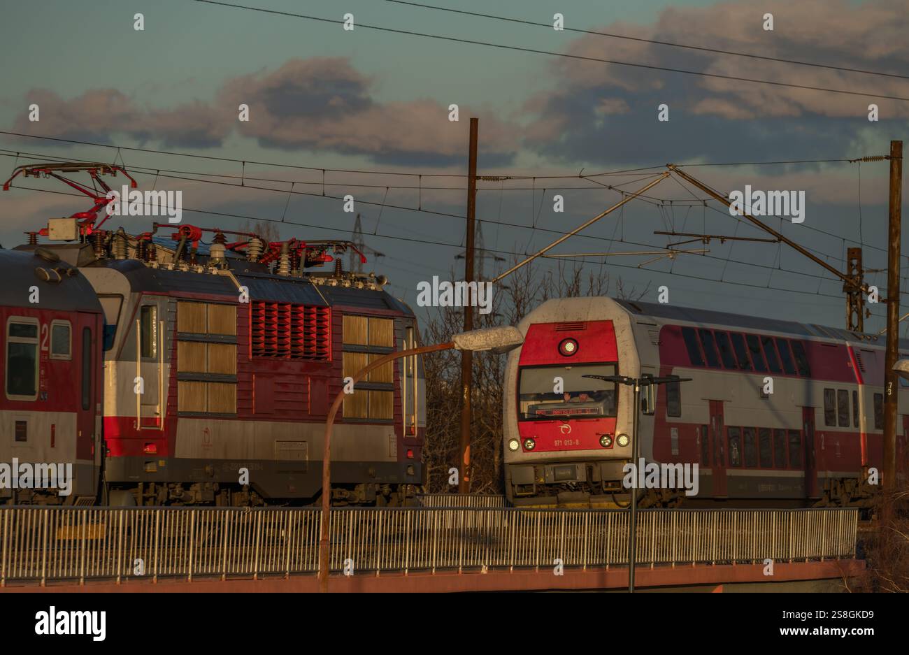 Trains and traffic near station Vinohrady with sunset evening in ...