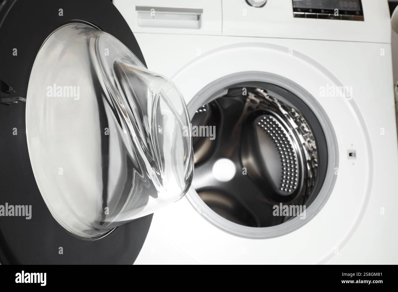 Washing machine with empty drum as background, closeup Stock Photo - Alamy