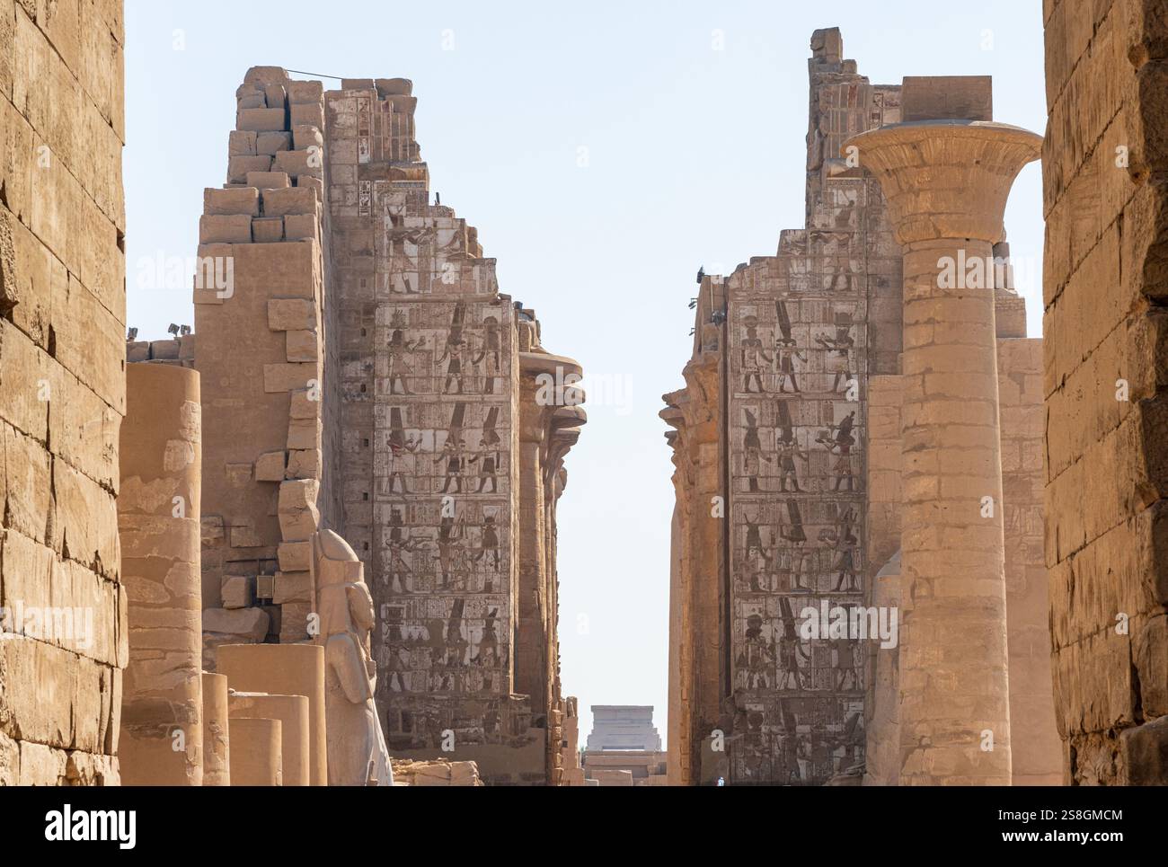 Ancient Egyptian Karnak temple with tall walls decorated with ...