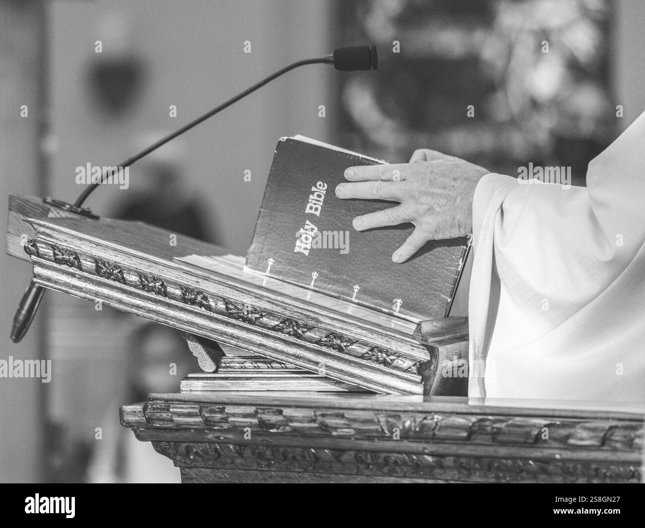 Pastor Priest Reading from the Bible in church Stock Photo - Alamy