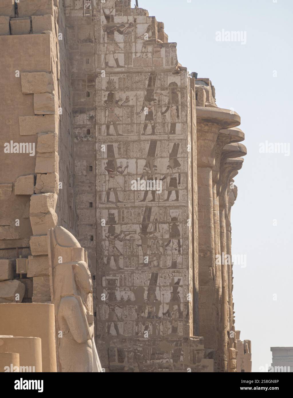 Ancient Egyptian Karnak temple with tall walls decorated with ...