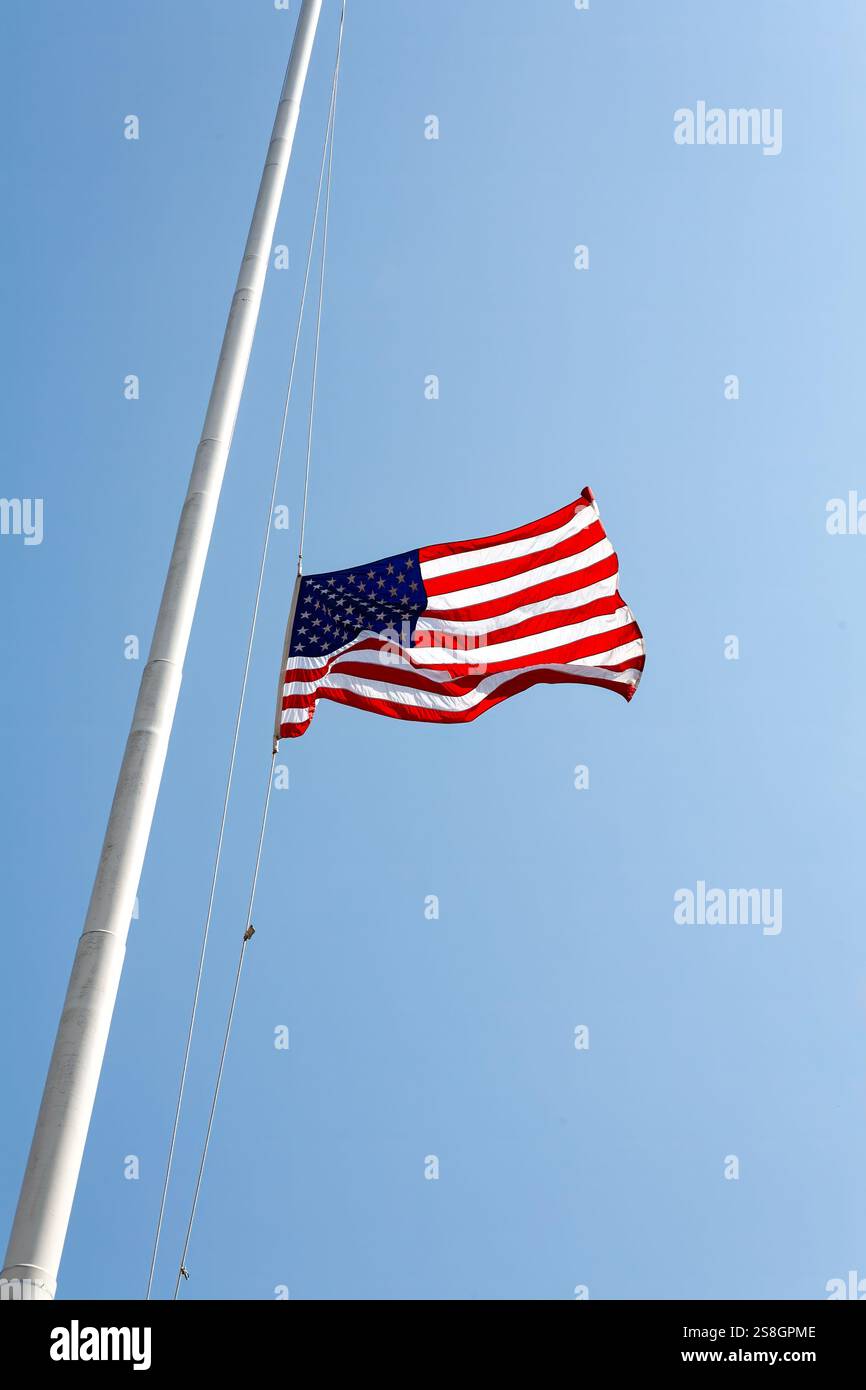 American flag flying at half-staff Stock Photo - Alamy