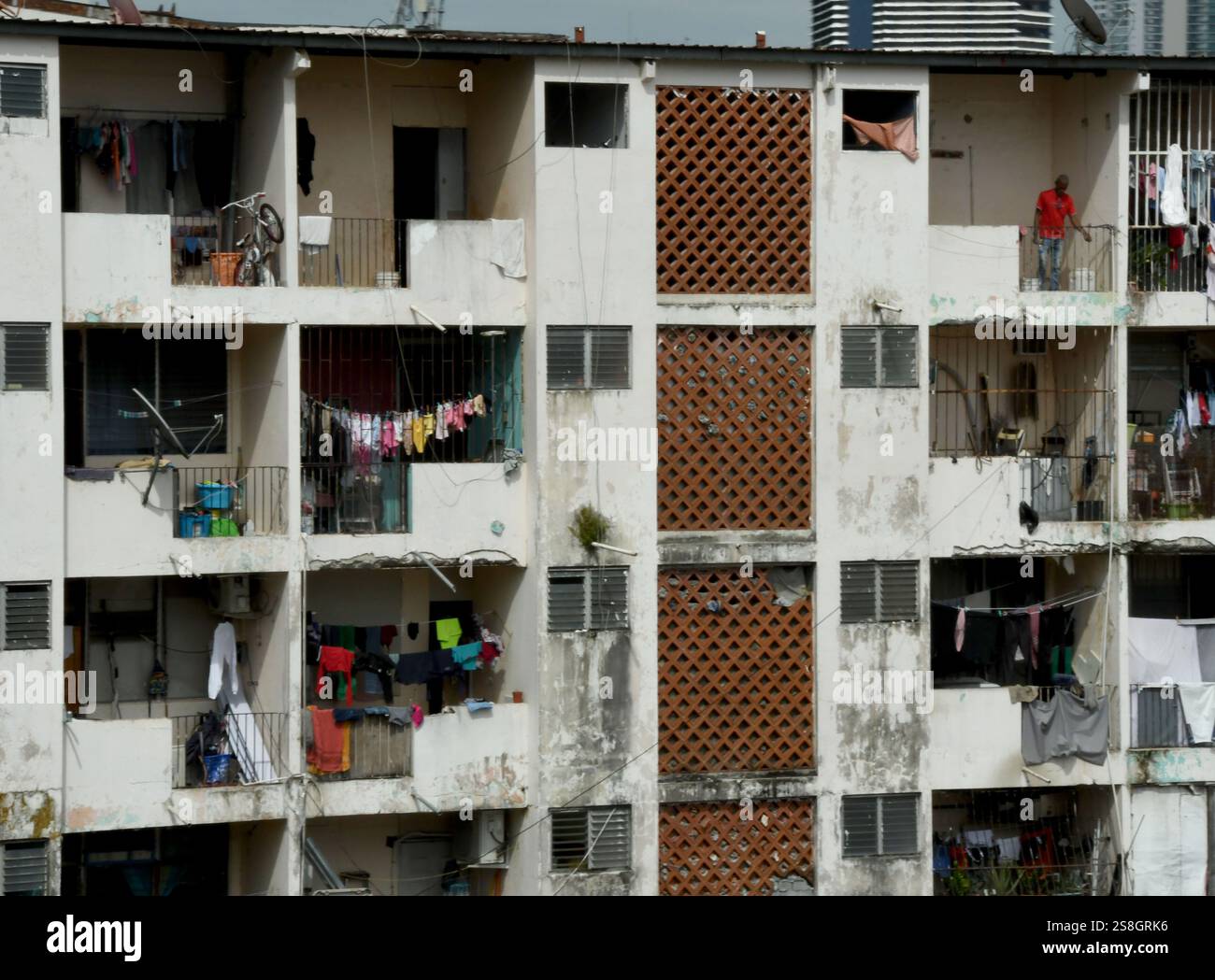 Panama City, USA. 11th Jan, 2025. A man stands on his balcony in an ...