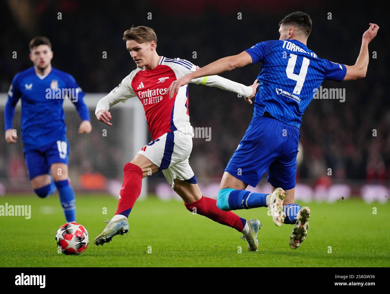 Arsenal's Martin Odegaard (centre left) and Dinamo Zagreb's Raul ...