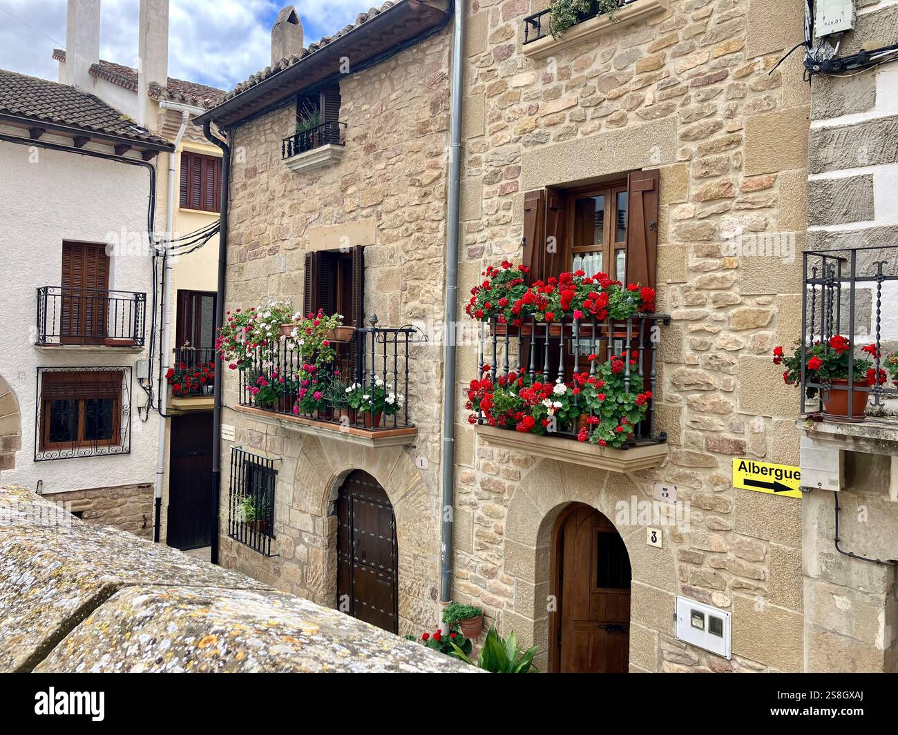 Traditional Spanish Houses with Ornate Balconies, Shutters, Stonework ...