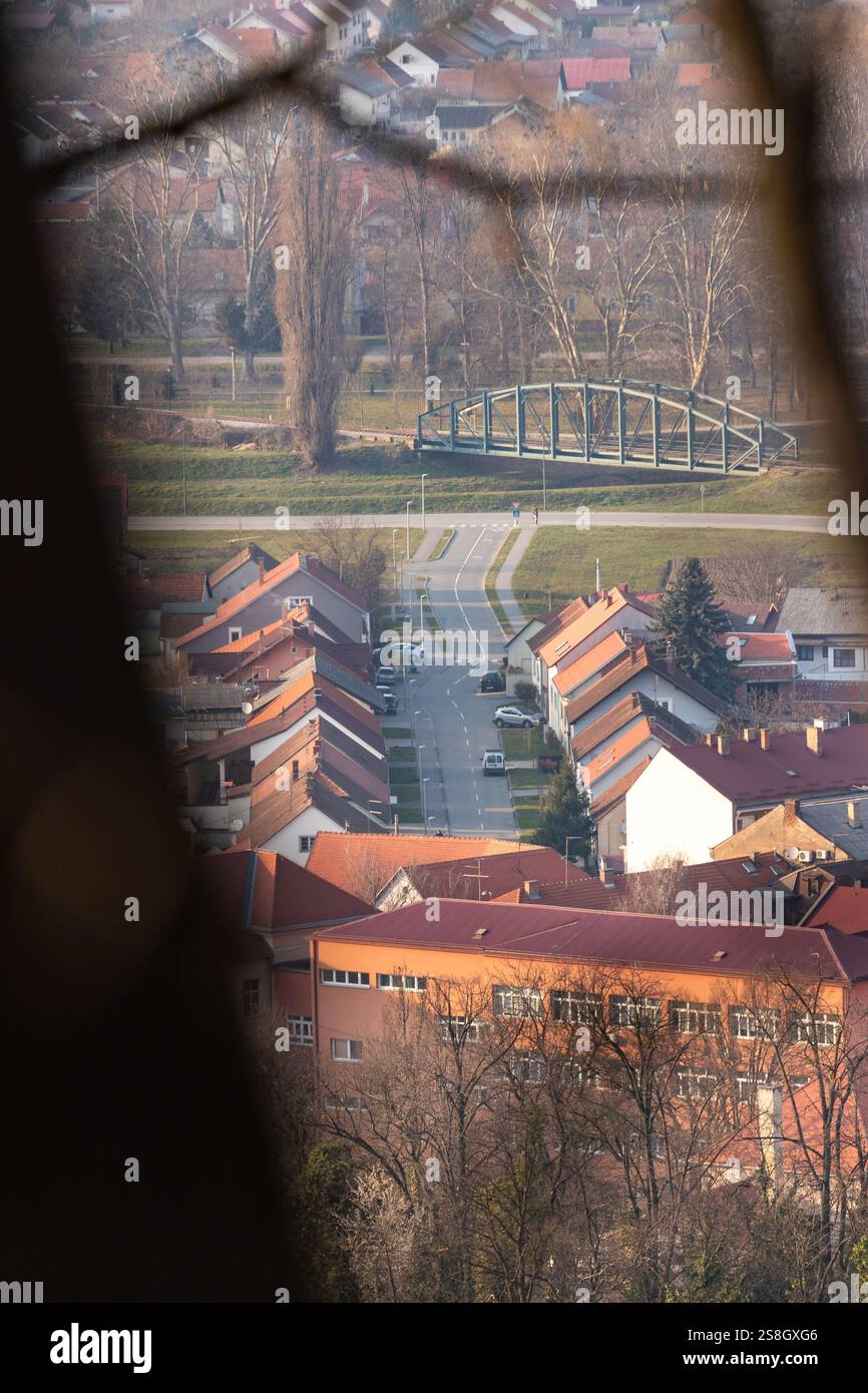 Old rusty truss bridge over the Orljava river. View from the hill Stock ...