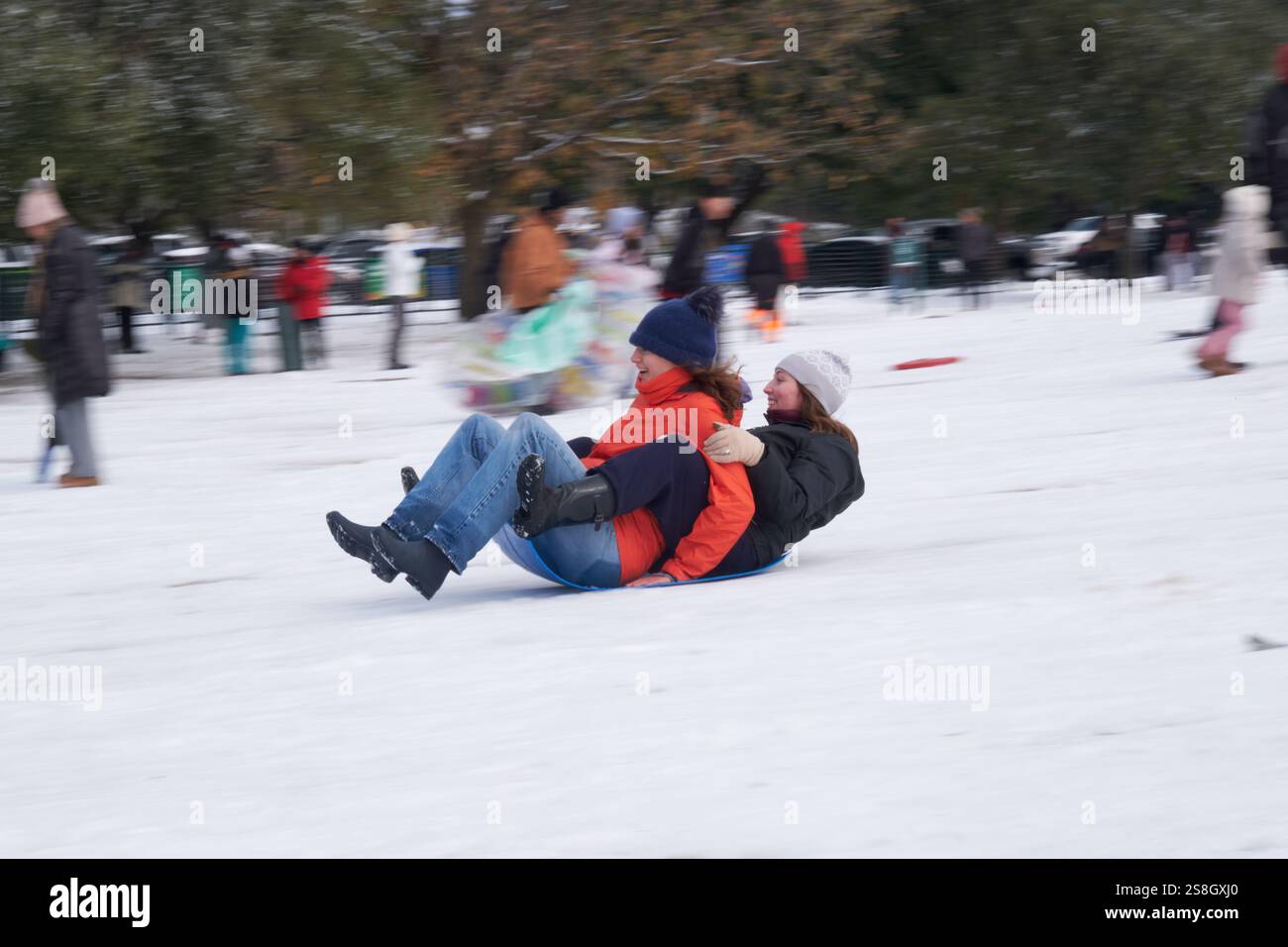 Houston, Texas, USA. 21st Jan, 2025. Residents play in the snow at ...