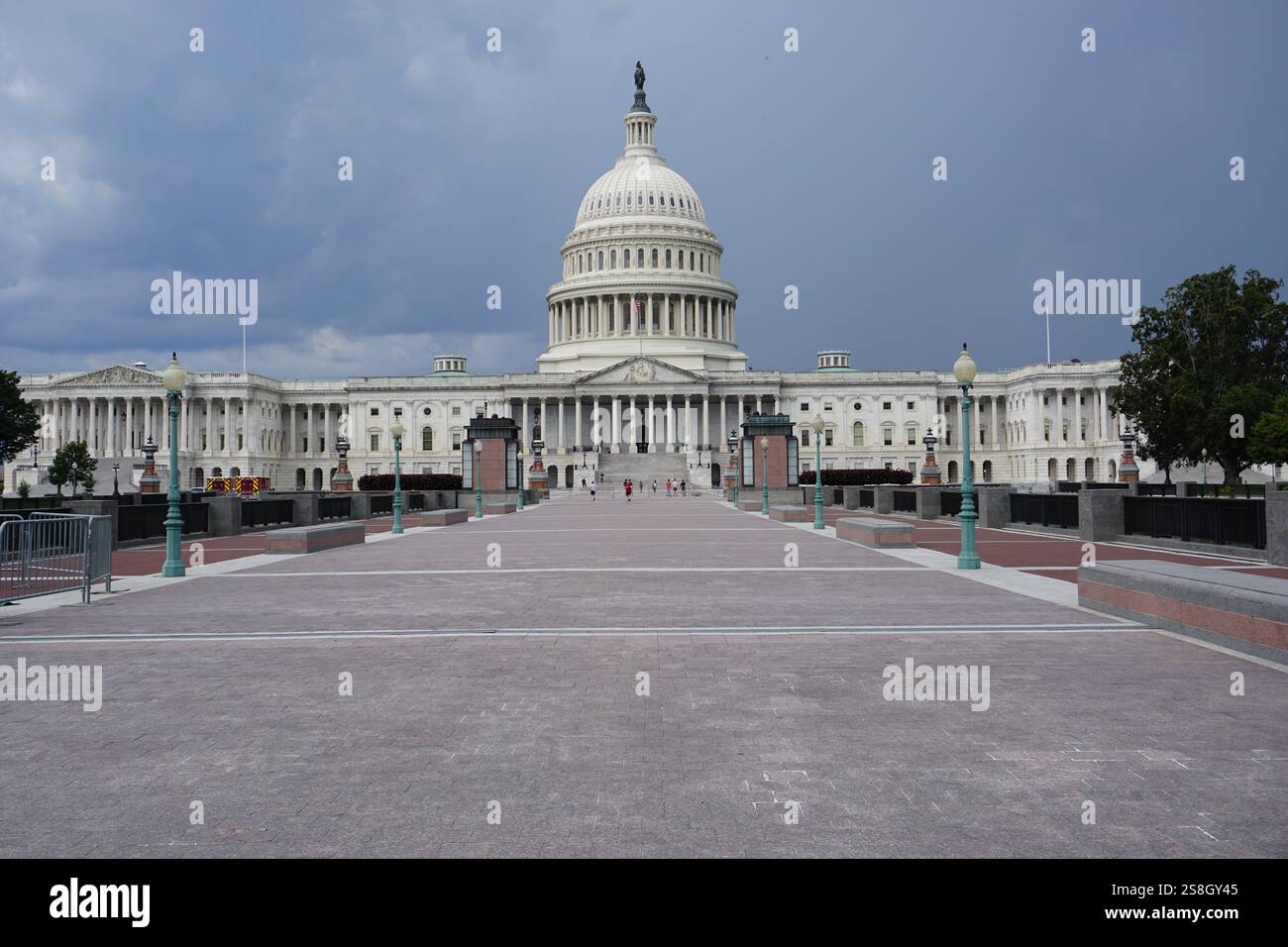 Visitors in front of the east side facade of the United States capitol ...