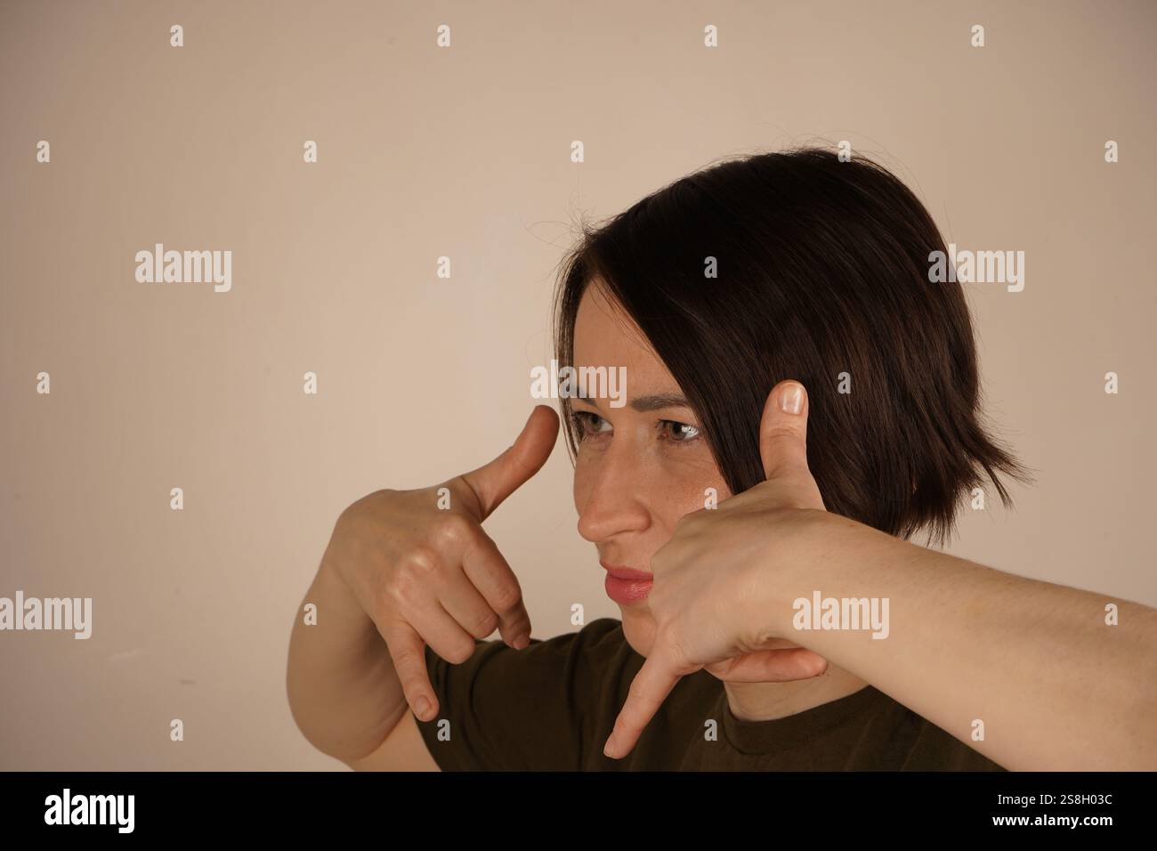 Happy positive asian woman making "call me" gesture, smiling happily ...