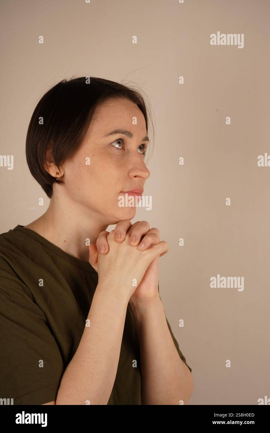 Portrait of a beautiful mature woman praying. Countenance. Man and ...
