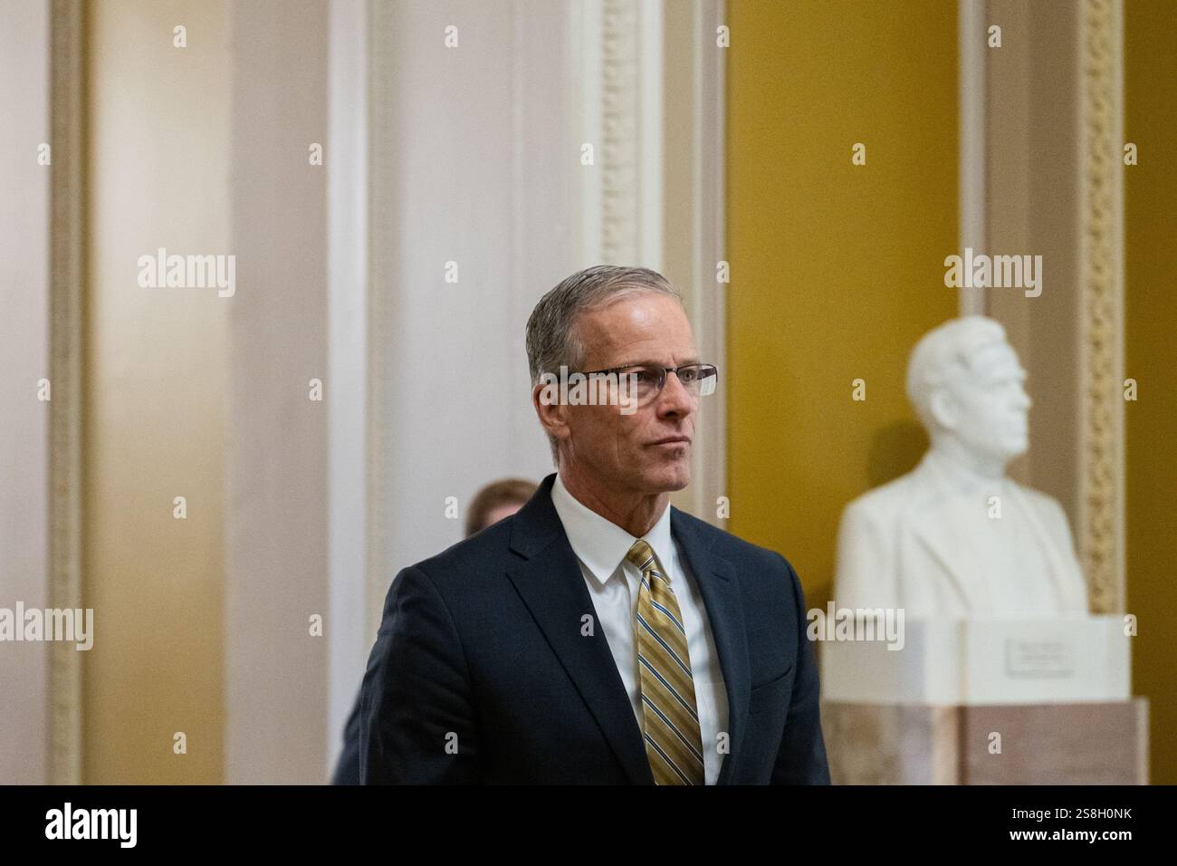 Senate Majority Leader John Thune, R-SD, walks into the Senate chamber ...