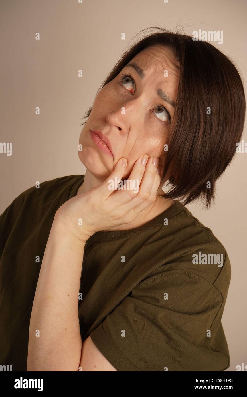 Sad asian woman touching cheek and frowning, having toothache, need see ...