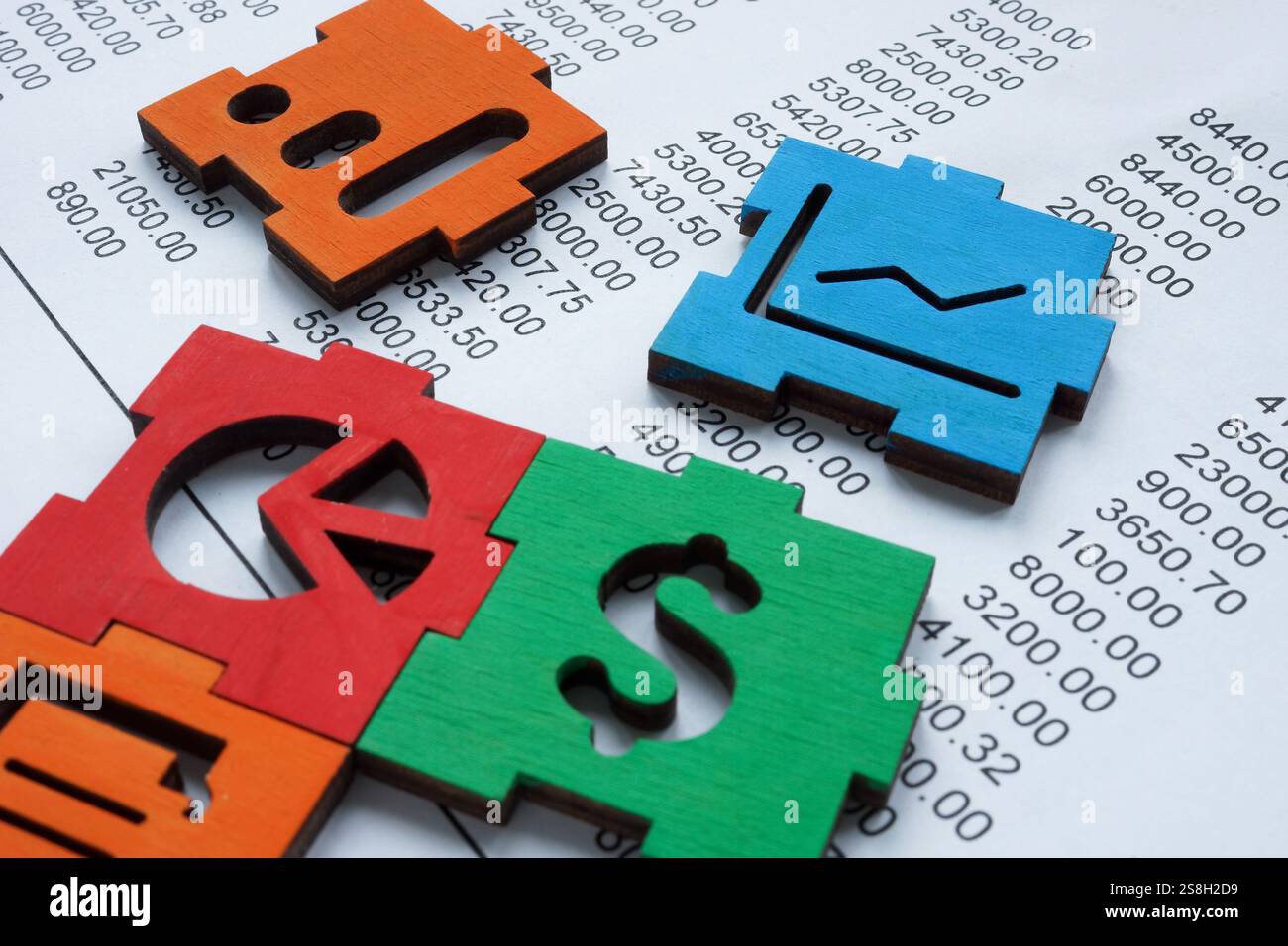 Puzzle pieces representing business planning and reporting. Financial ...