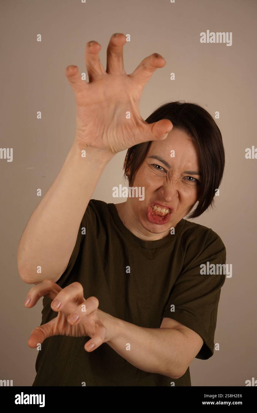 Brunette woman in casual clothes expressing disgust, reluctance ...