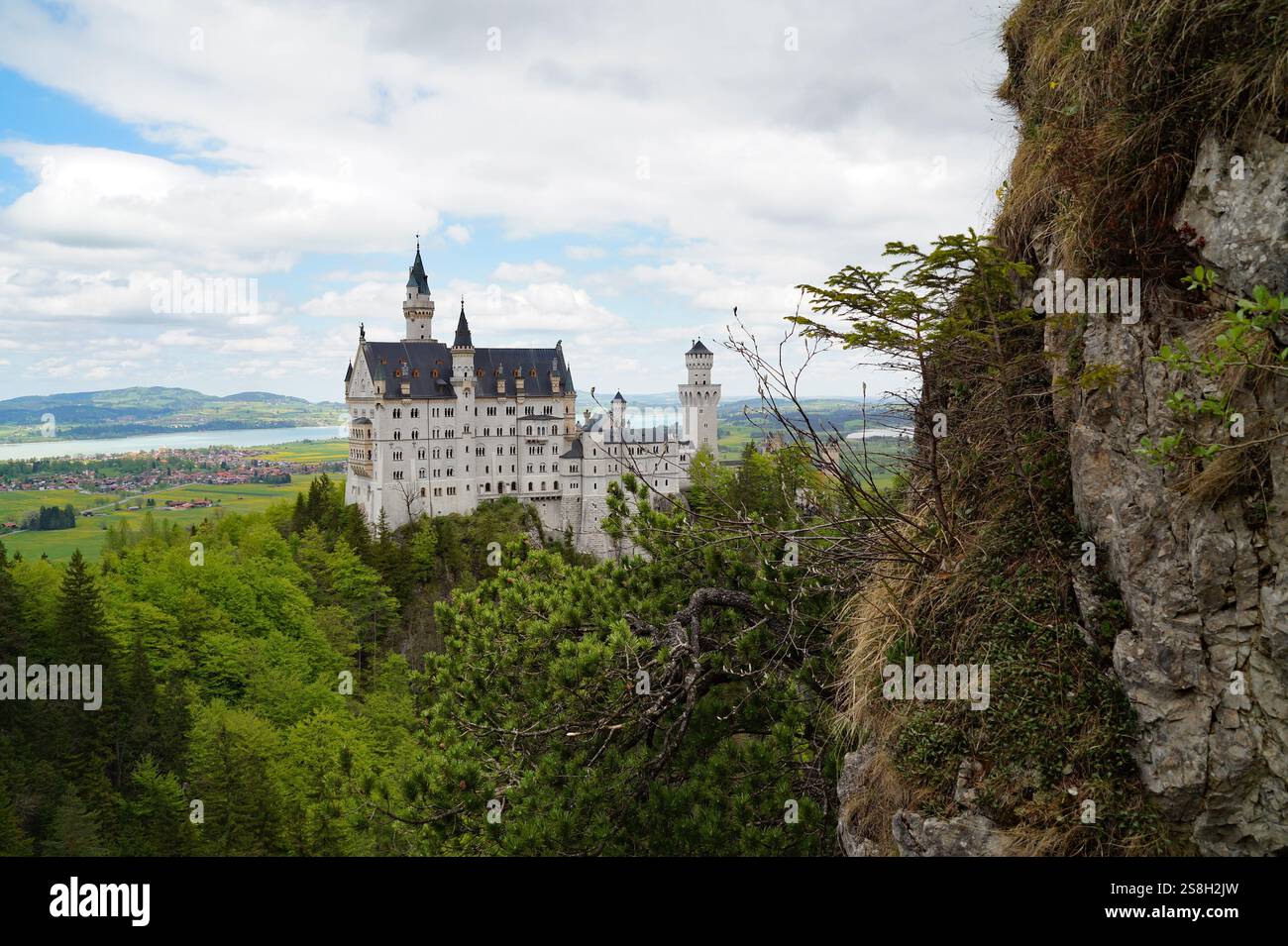Medieval castle Neuschwanstein on a rugged hill in the Bavarian Alps ...