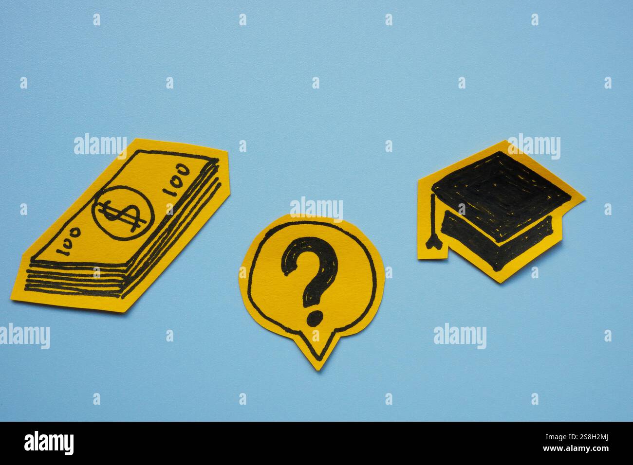 Student loans and financial decisions. Graduation cap, dollar bills ...