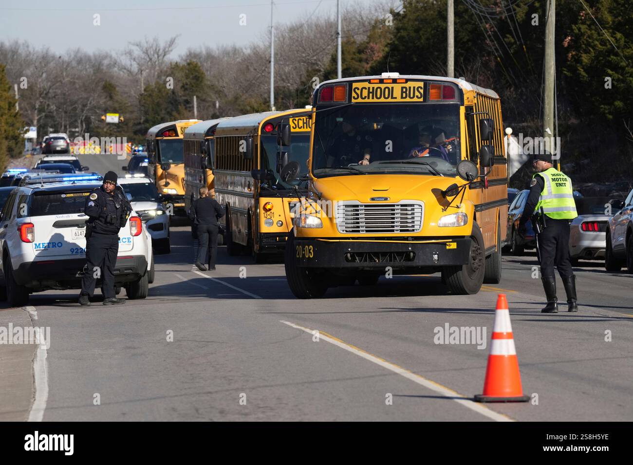 School buses arrive at a unification site following a shooting at the ...