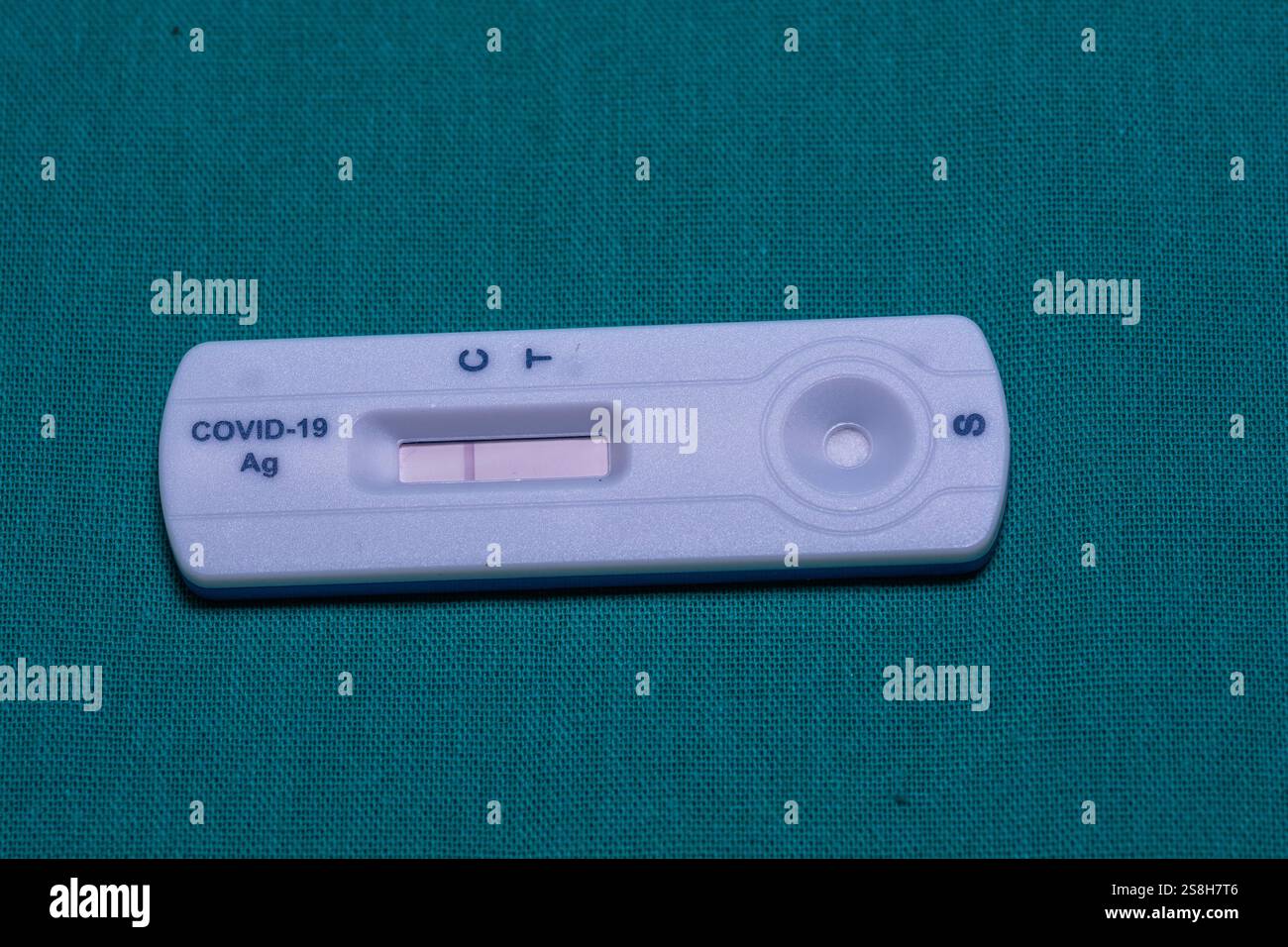 Close-up of a single COVID-19 rapid antigen test cassette showing one ...