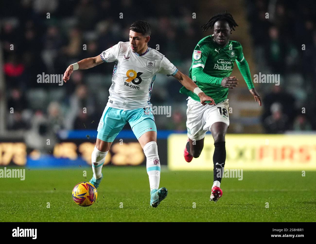 Burnley's Jeremy Sarmiento (left) and Plymouth Argyle's Darko Gyabi battle for the ball during ...