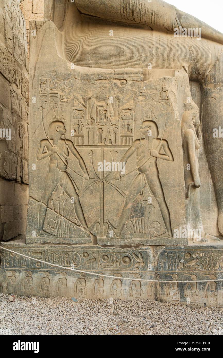 Engravings on base of massive stone statue of Ramesses II stands in ...